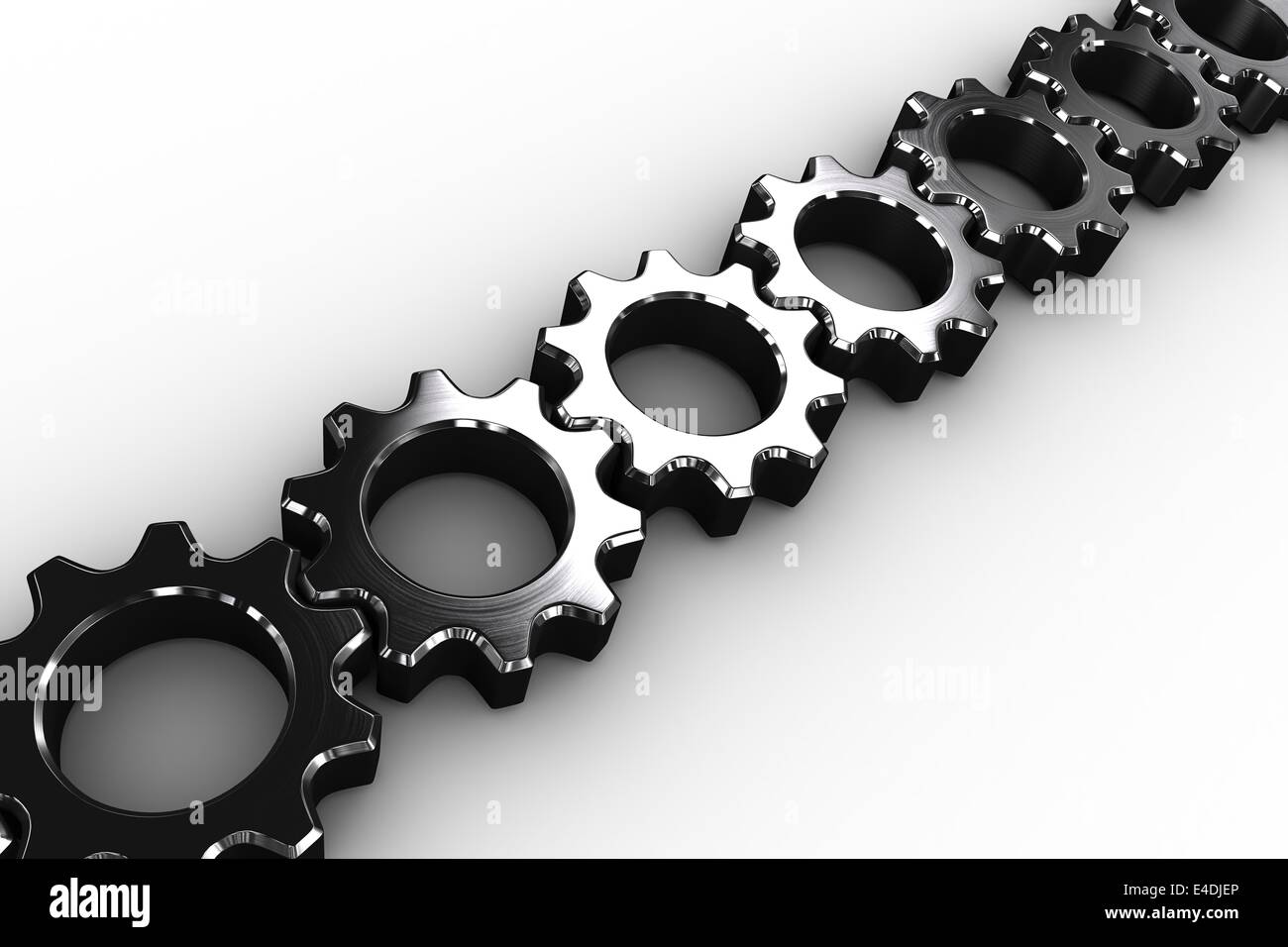 Metal cogs and wheels connecting Stock Photo - Alamy