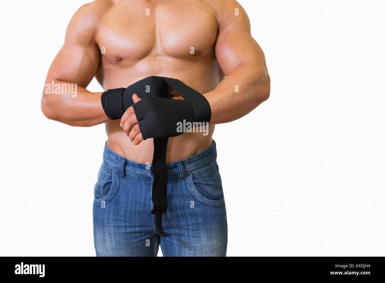 Mid section of a muscular man binds bandage on his hand Stock Photo - Alamy