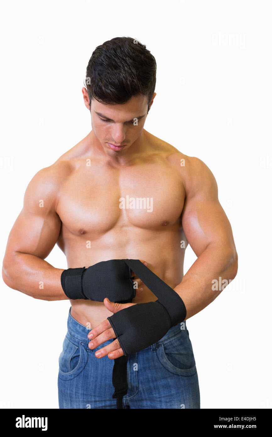 Shirtless muscular man binds bandage on his hand Stock Photo - Alamy
