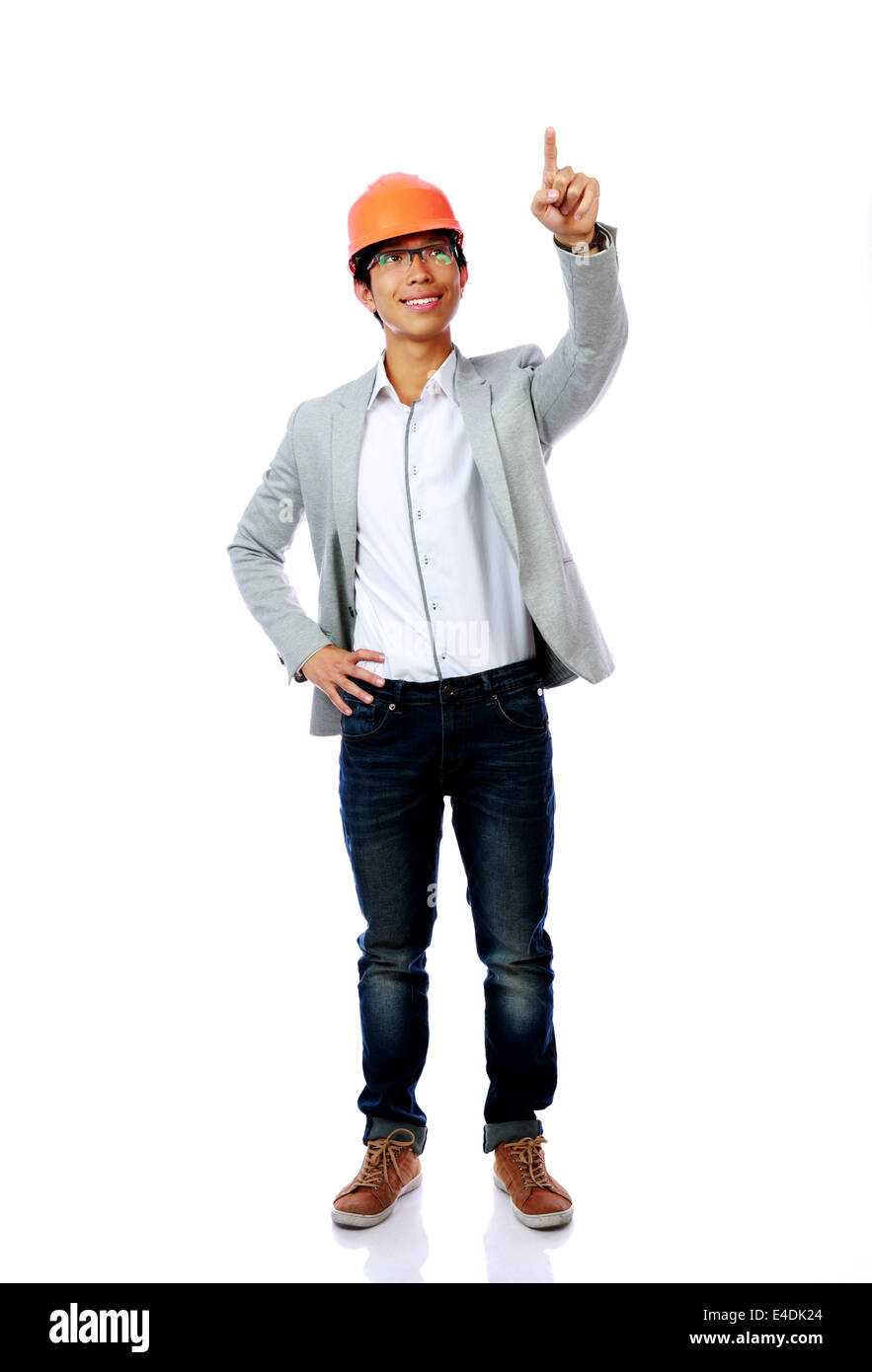 Full length portrait of asian engineer man point up isolated on white ...