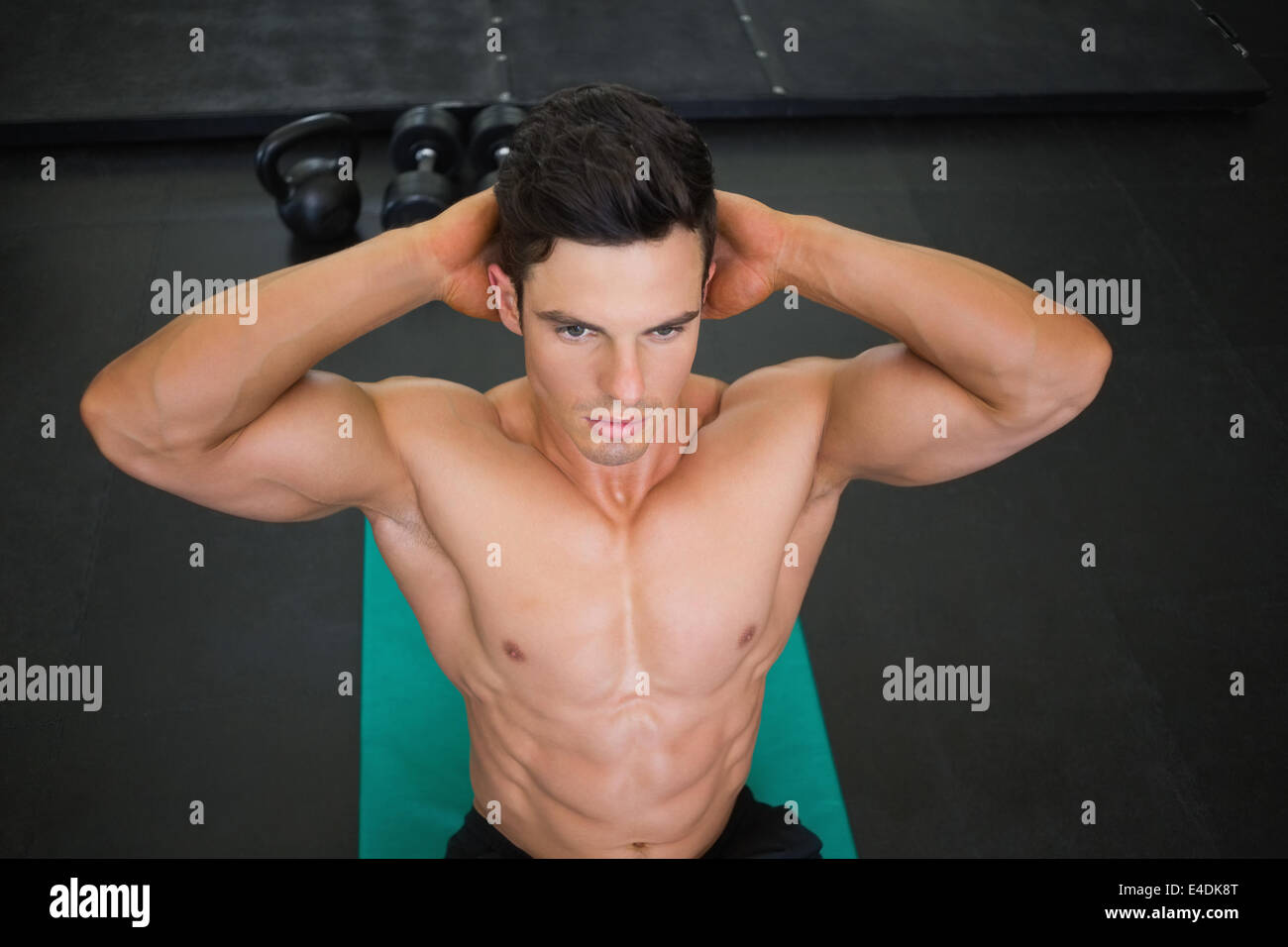 Muscular man doing abdominal crunches in gym Stock Photo - Alamy