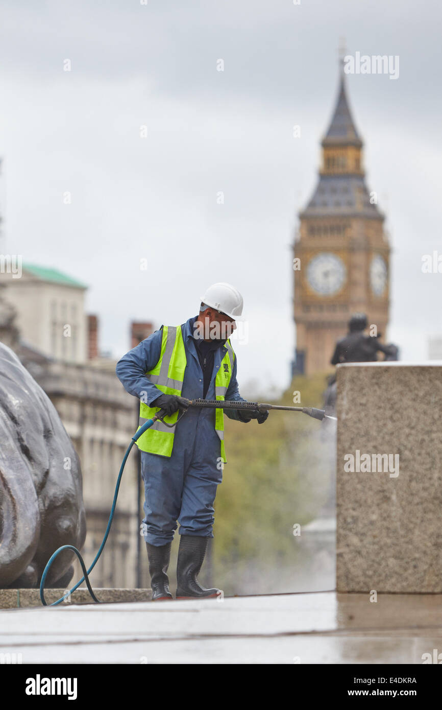 Workman cleaning graffiti off Nelson's Column in Trafalgar Square ...