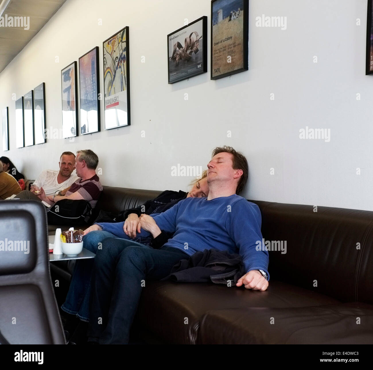 Couple sleep in a café Stock Photo - Alamy