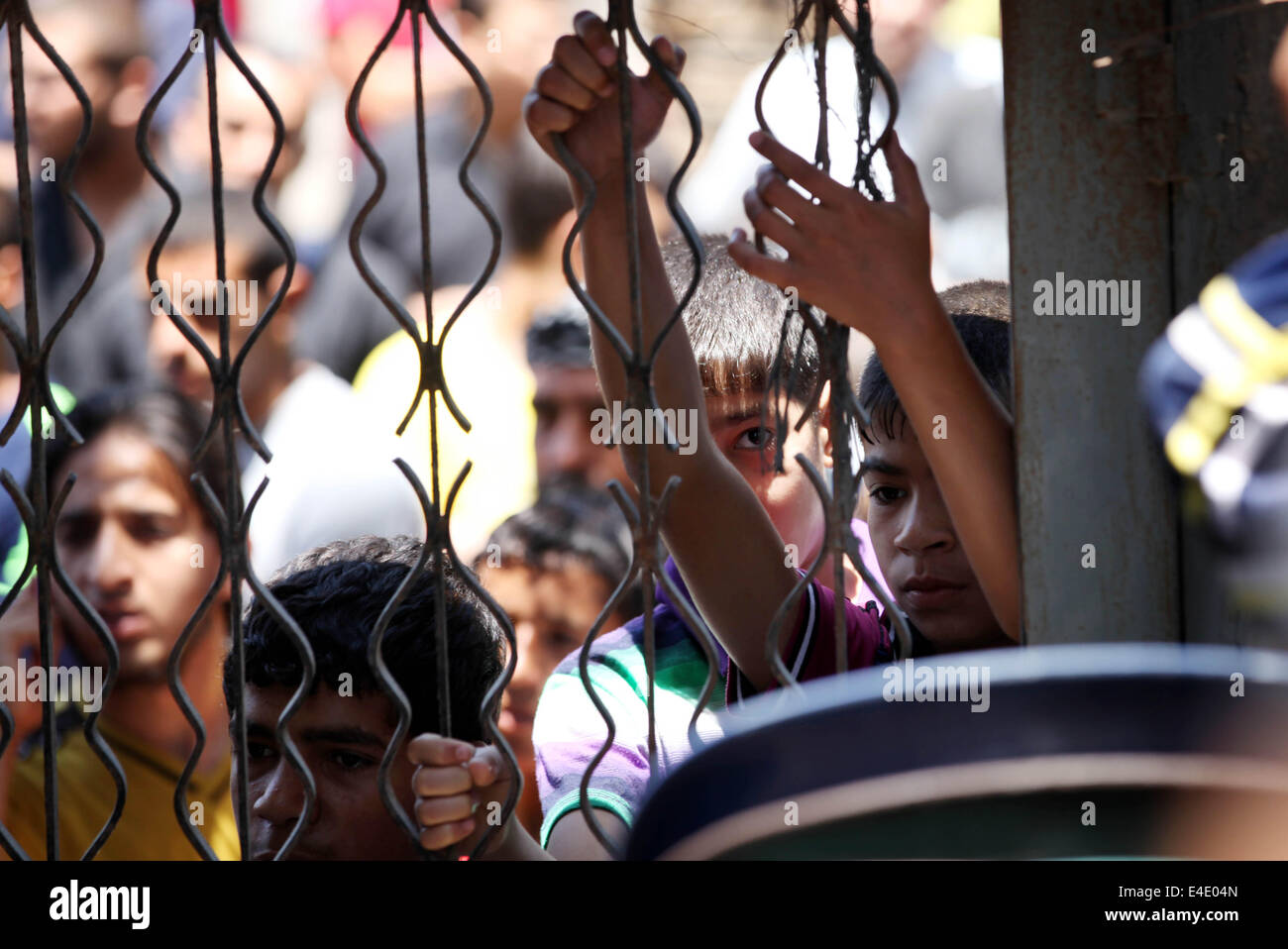 Gaza, Palestinian Territories. 7th July, 2014. Mourners carry the body ...