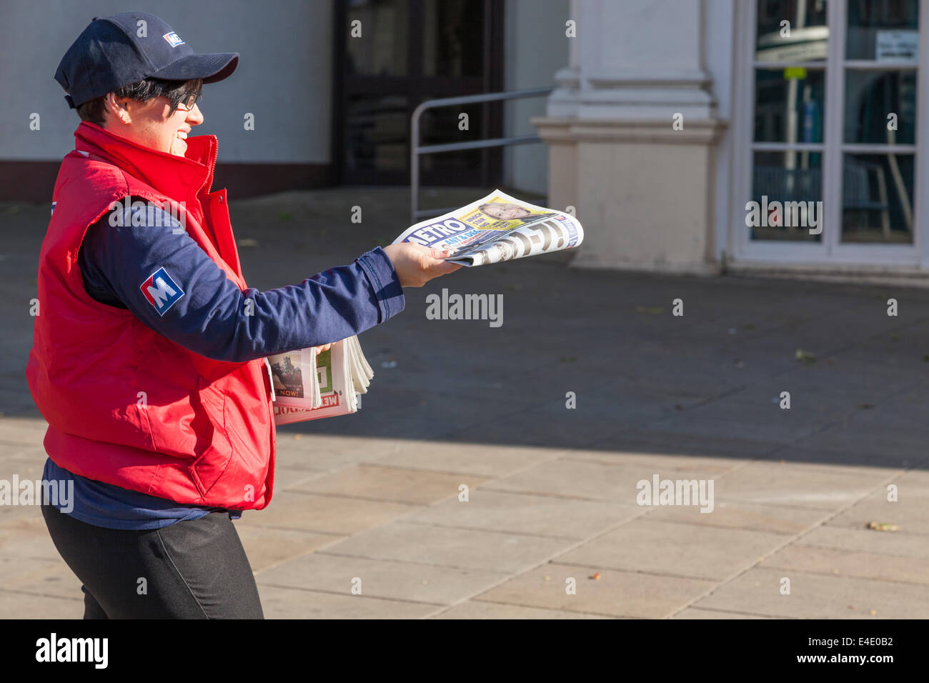 Free newspaper distributor. Person distributing Metro newspapers ...