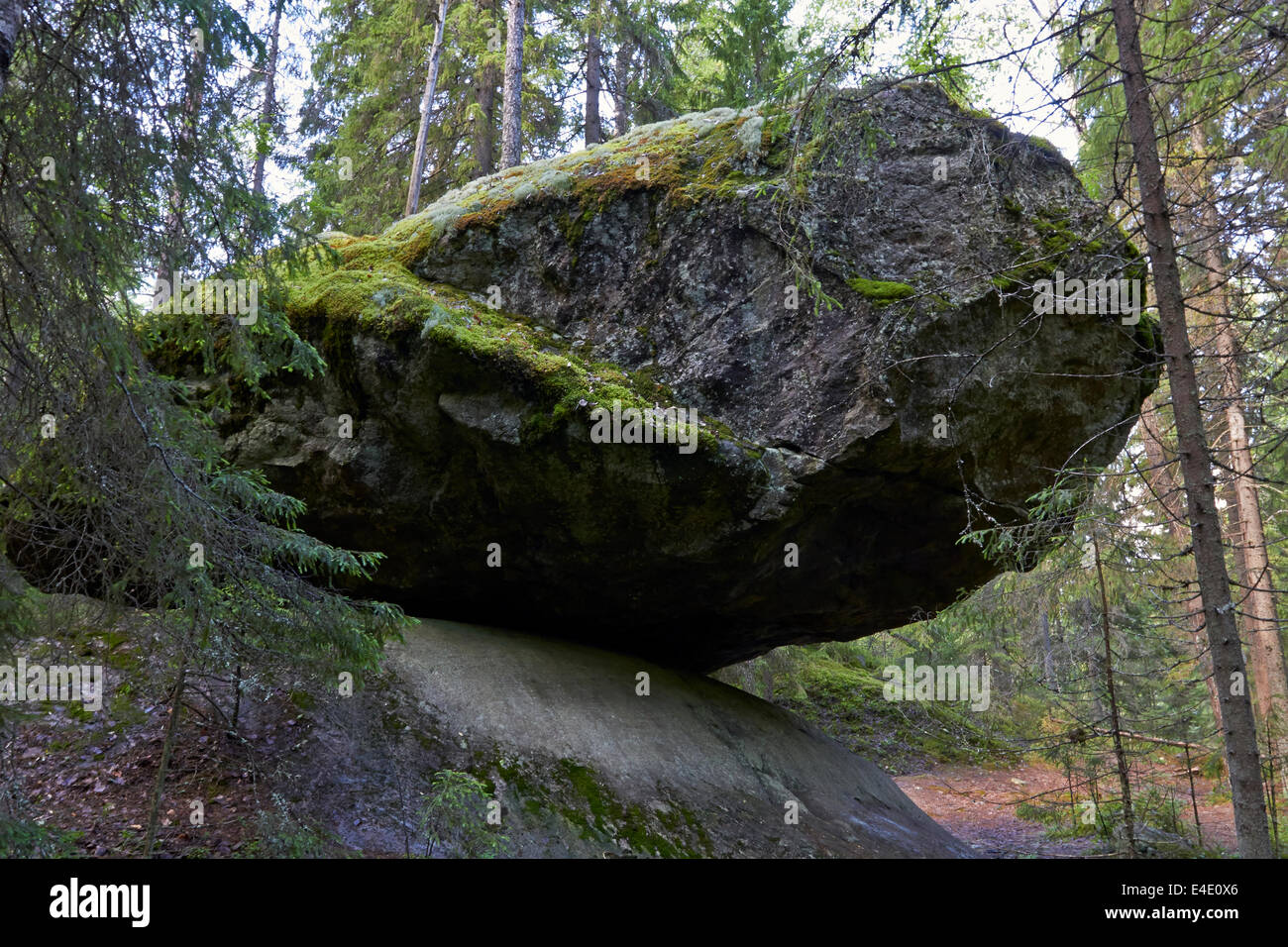 Kummakivi, balancing boulder on bedrock in Ruokolahti Finland Stock ...
