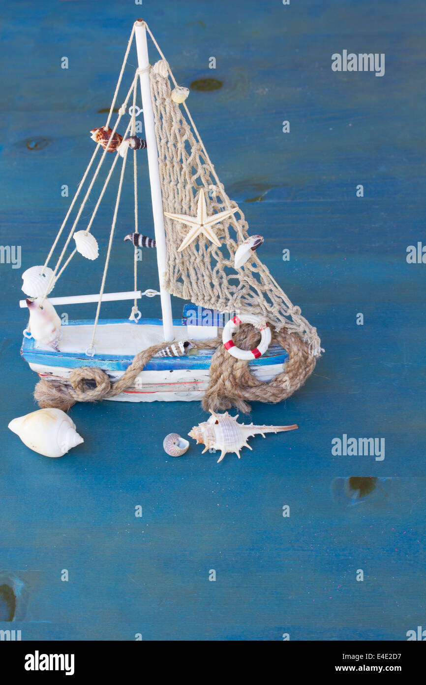 Seashells and boat Stock Photo - Alamy