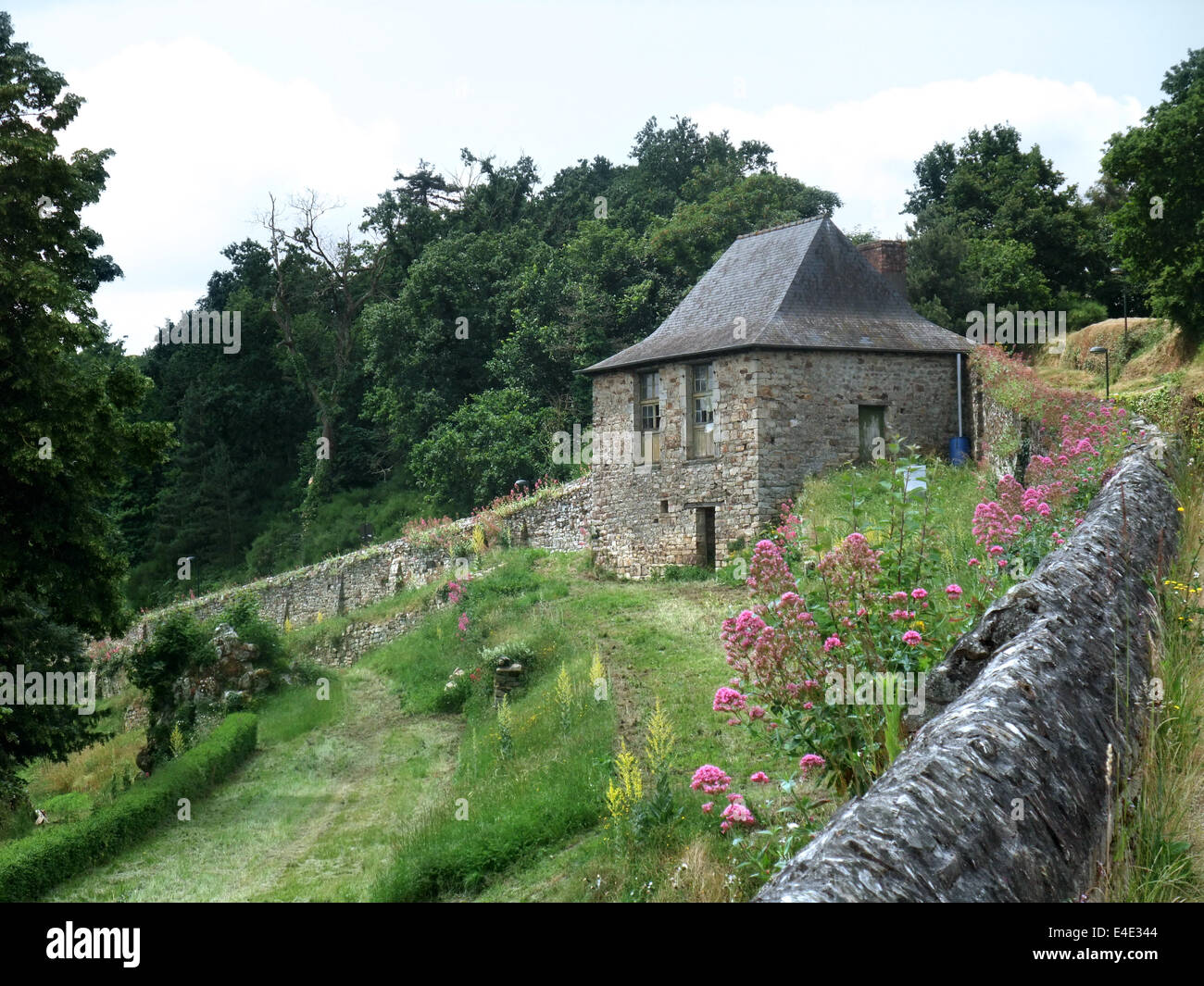 small stone building and wall seen in France Stock Photo - Alamy