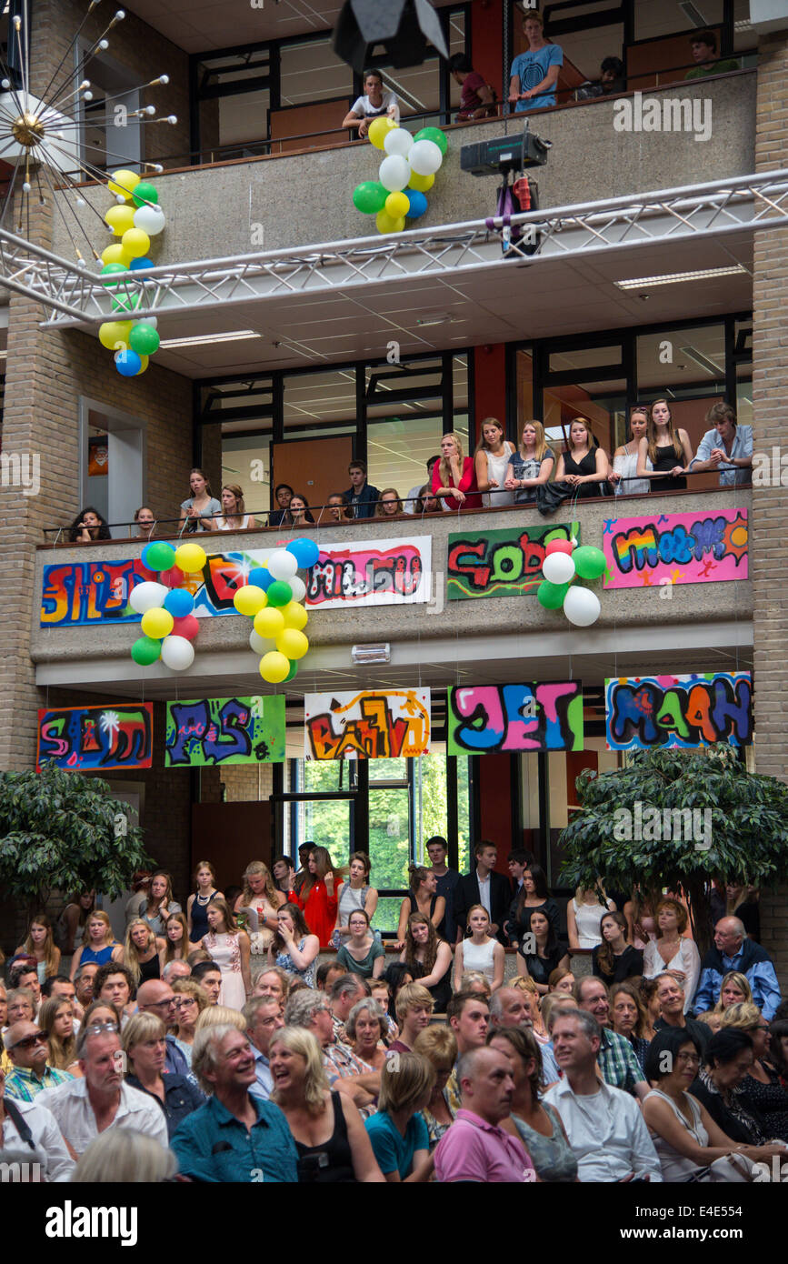 many parents in a highschool together to celebrate the scholars who ...