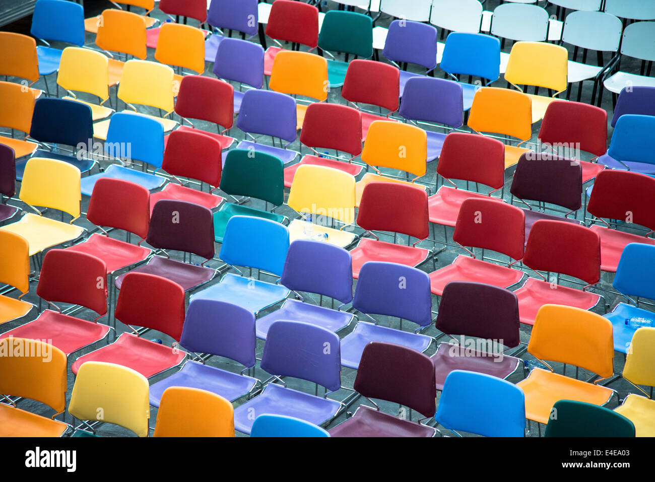 rows of colorful and empty plastic chairs in a school Stock Photo - Alamy