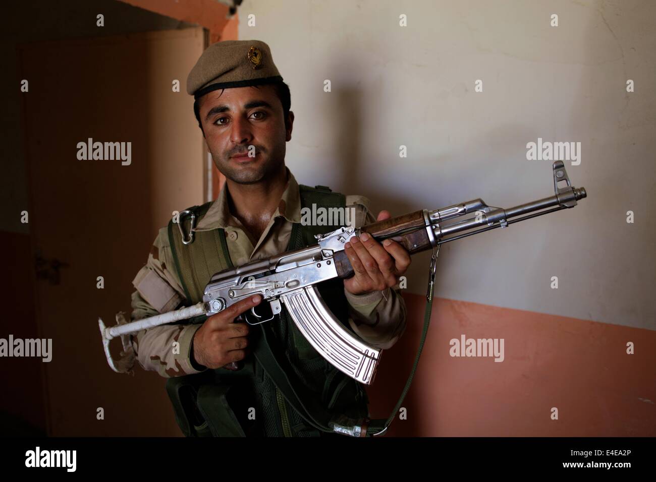 Kirkuk, Iraq. 7th July, 2014. Kurdish Permerga fighter proudly poses ...
