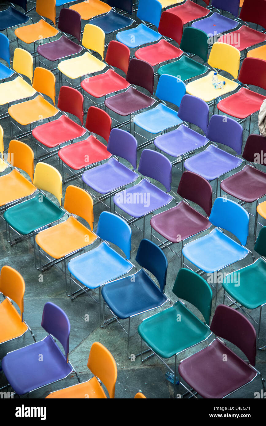 rows of colorful and empty plastic chairs in a school Stock Photo - Alamy
