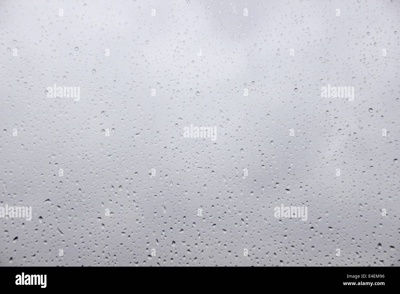 Raindrops on a window with heavy rain outside Stock Photo - Alamy
