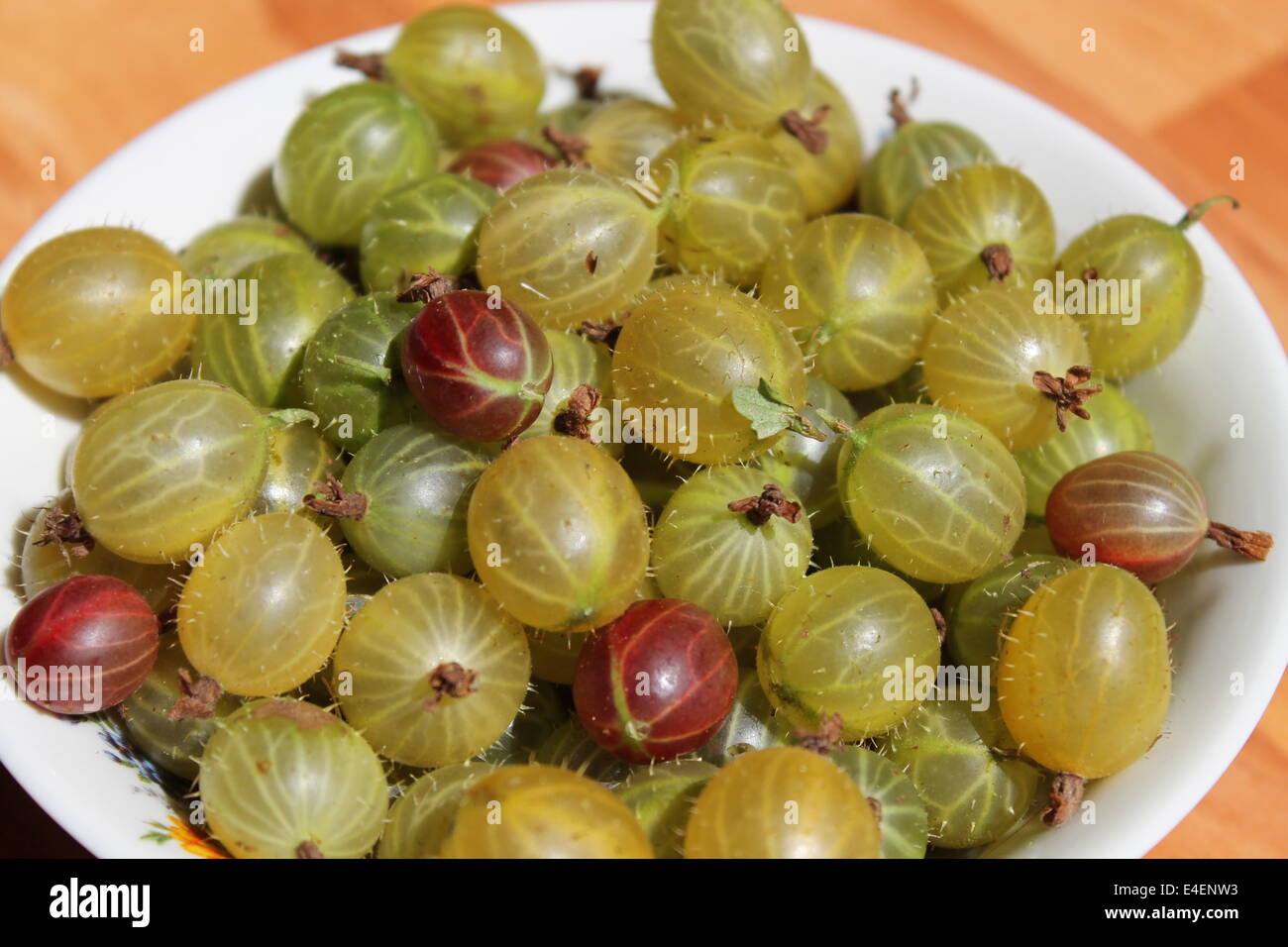yellow sweet garden ripe gooseberries on the plate Stock Photo - Alamy