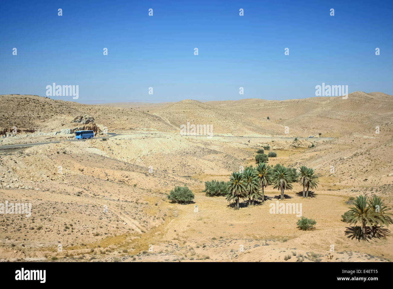 A bus passing through the Sahara desert in Matmata, Tunisia Stock Photo ...