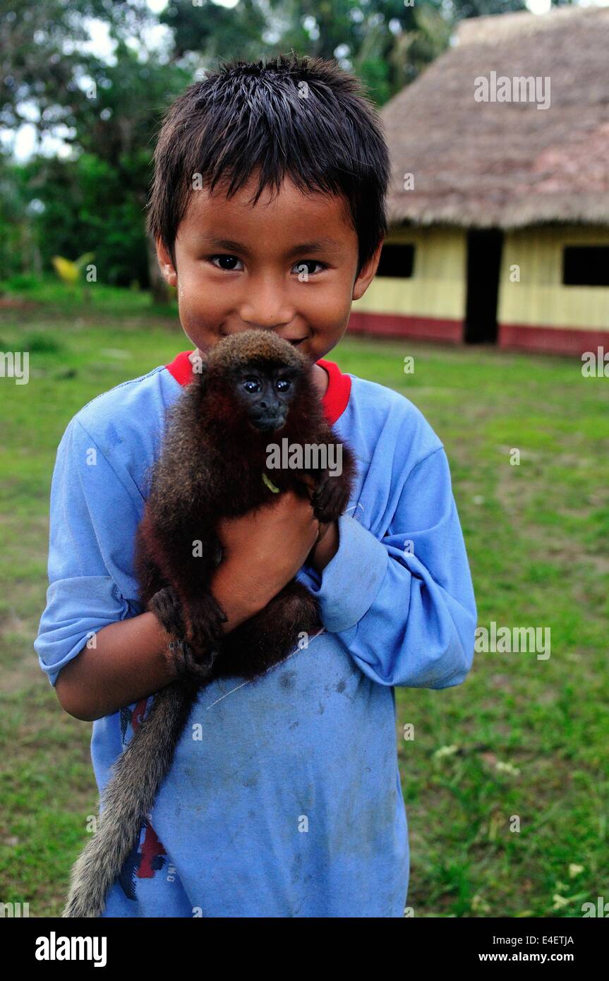 Indigenous child with monkey hi-res stock photography and images - Alamy