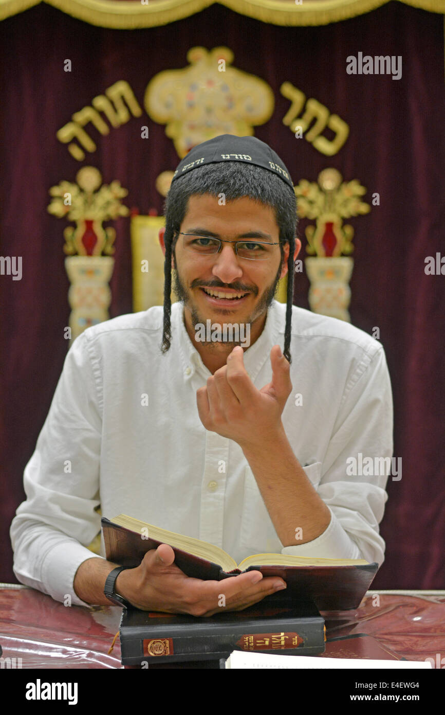 Portrait of an Israeli religious orthodox Jewish young man with peyot ...