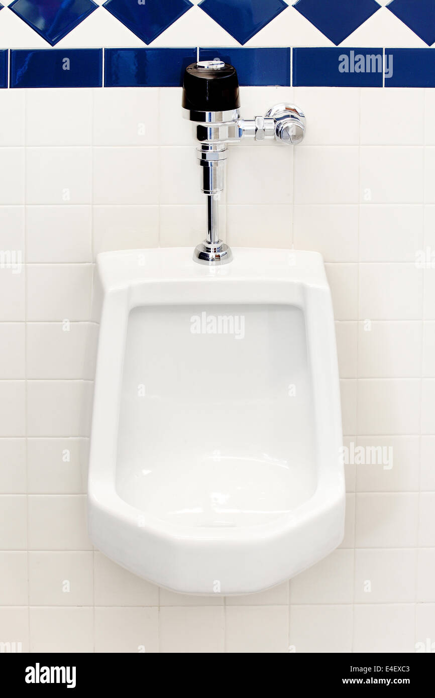 A water saving urinal in a modern public mens room Stock Photo - Alamy