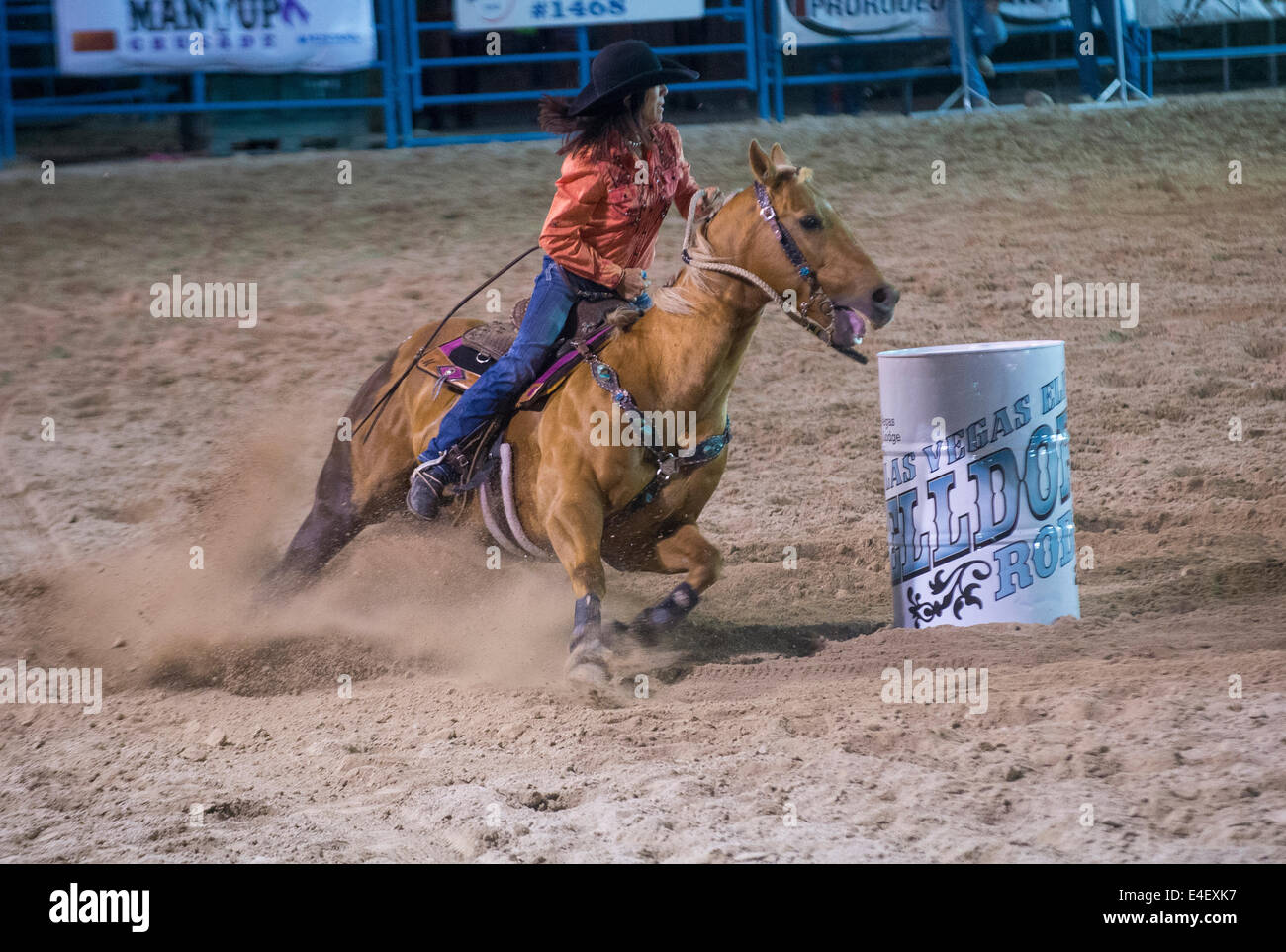 Cowgirl Participating in a Barrel racing competition at the Helldorado ...