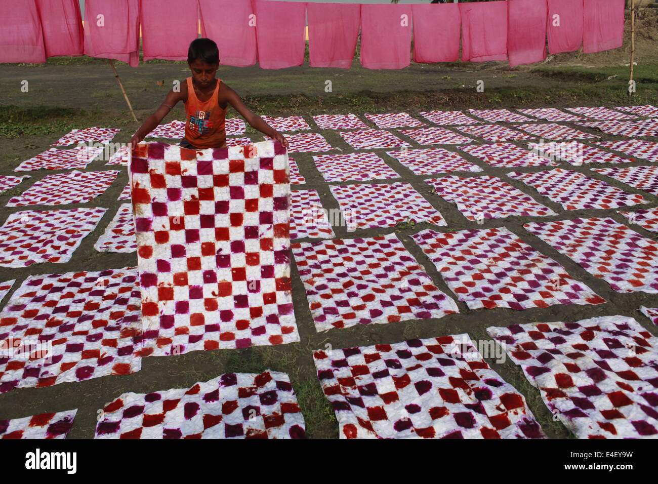 A boy drying dyed clothes,Adult,Art,Artisan,Artist,Artistic,Asia,Asian ...