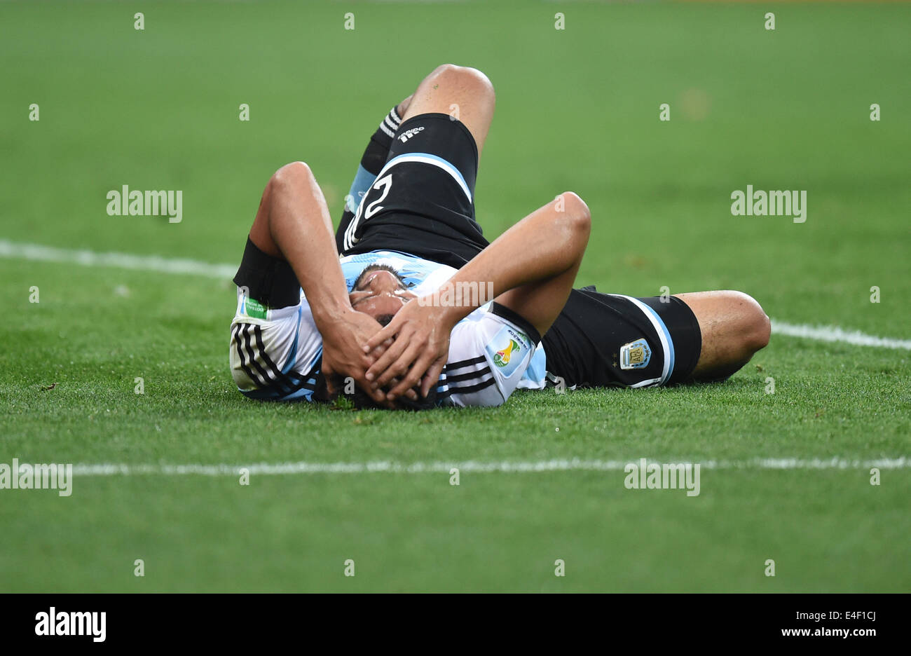 Sao Paulo, Brazil. 09th July, 2014. Ezequiel Garay of Argentina lies on ...