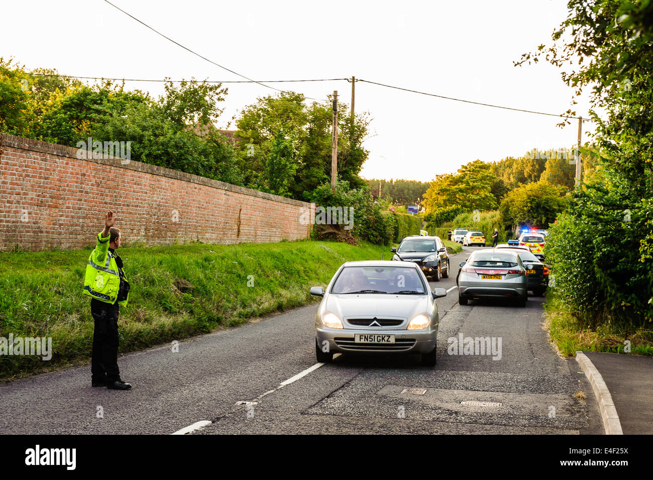 Police crime scene with police officer directing traffic Stock Photo ...