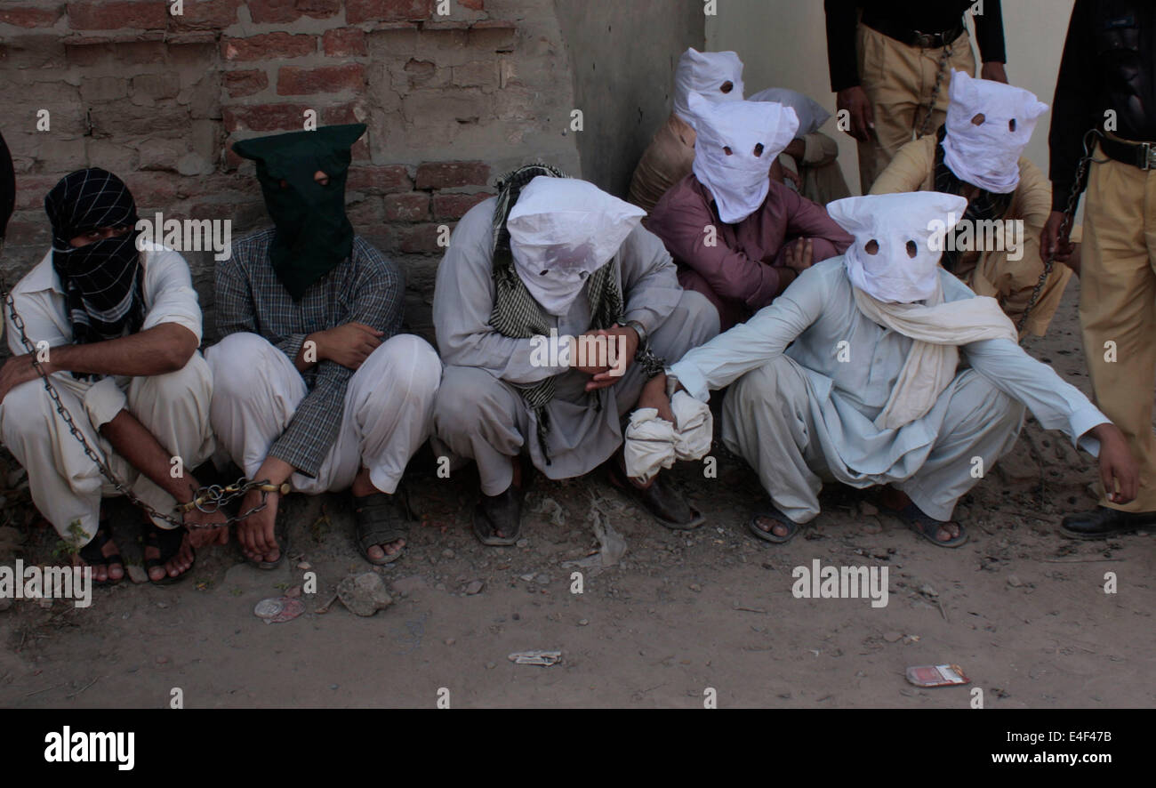 Lahore, Pakistan. 09th July, 2014. Pakistani Arrested suspects with ...