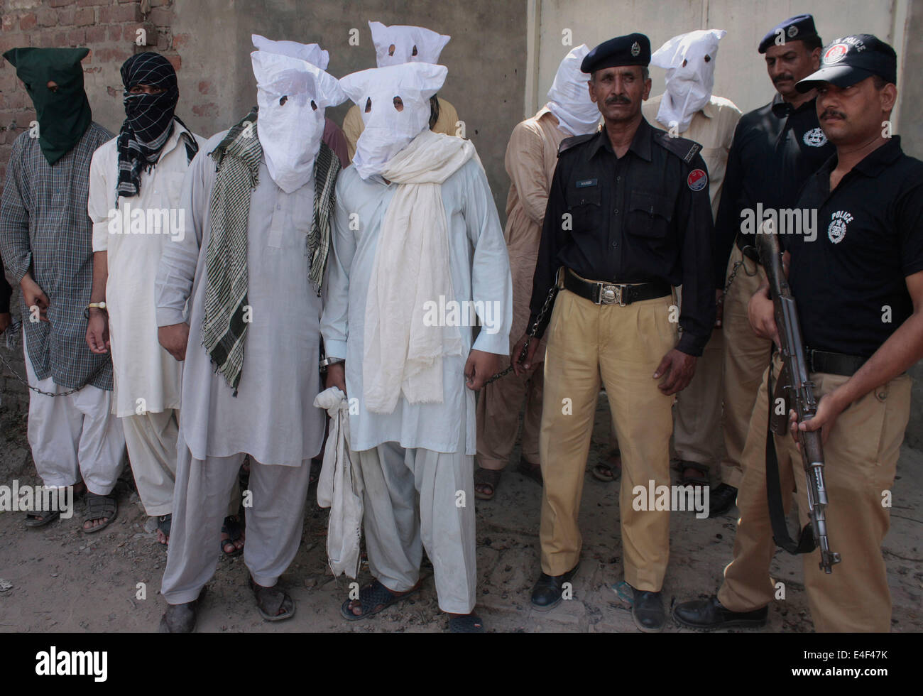 Lahore, Pakistan. 09th July, 2014. Pakistani Arrested suspects with ...