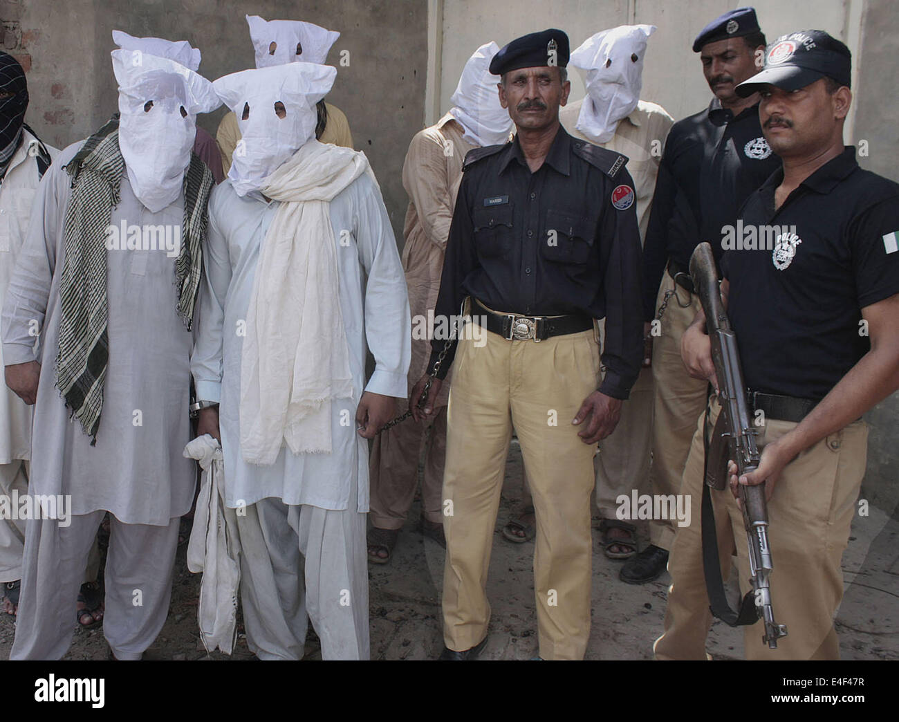 Lahore, Pakistan. 09th July, 2014. Pakistani Arrested suspects with ...