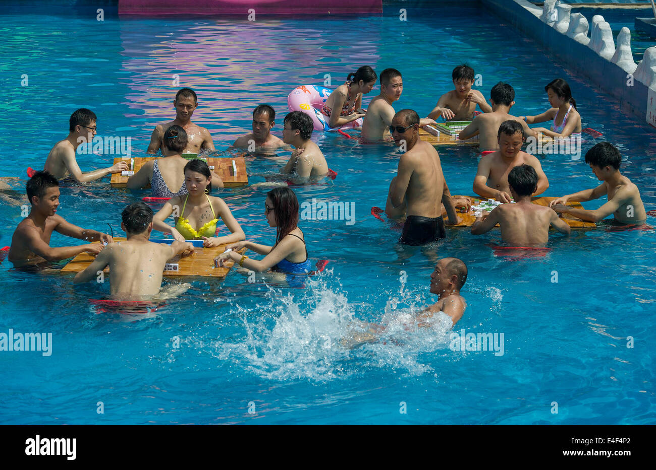 Chongqing, China. 8th July, 2014. Tourists experience the pleasure of ...