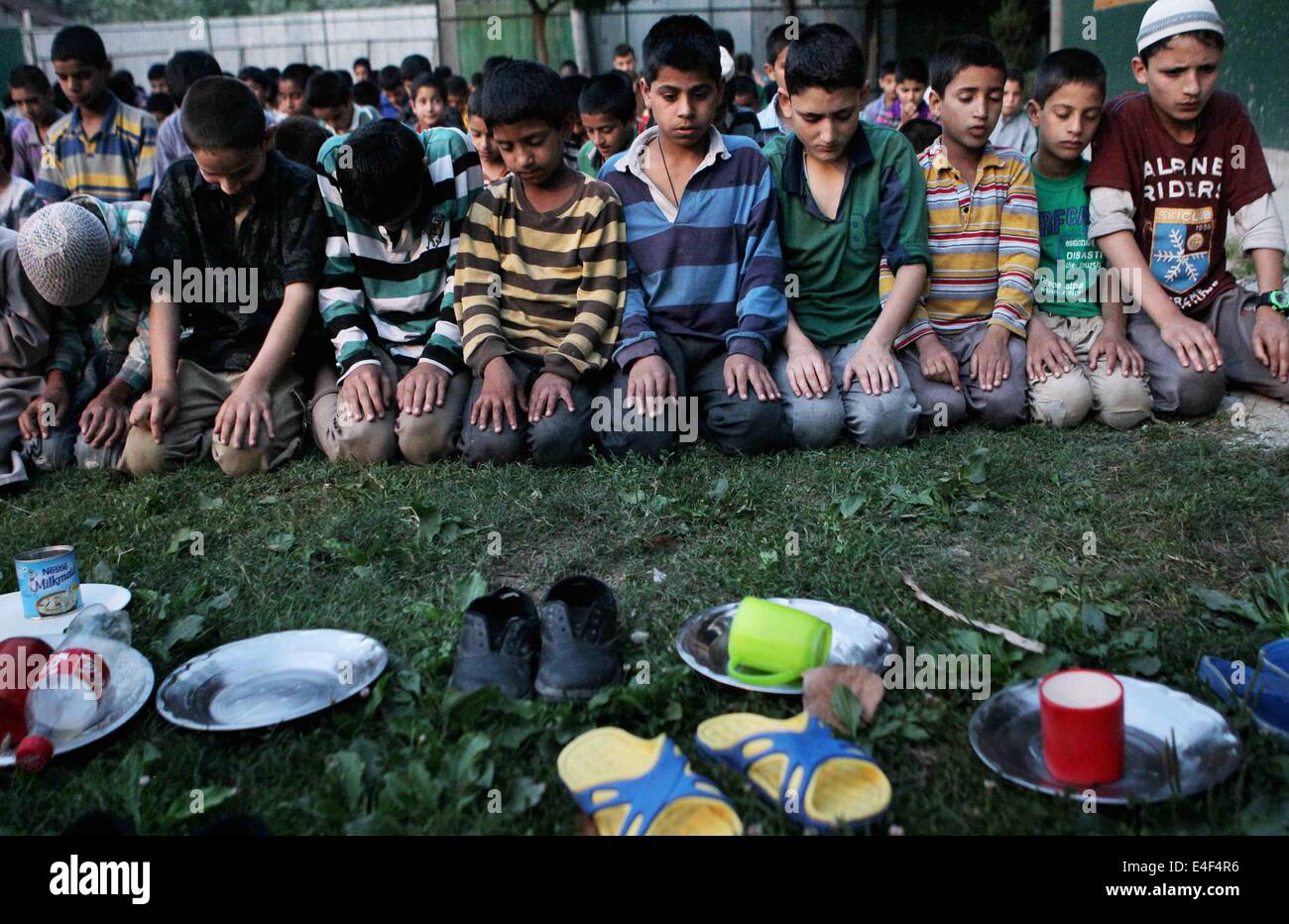 Kashmiri muslim orphans break ramadan hi-res stock photography and ...