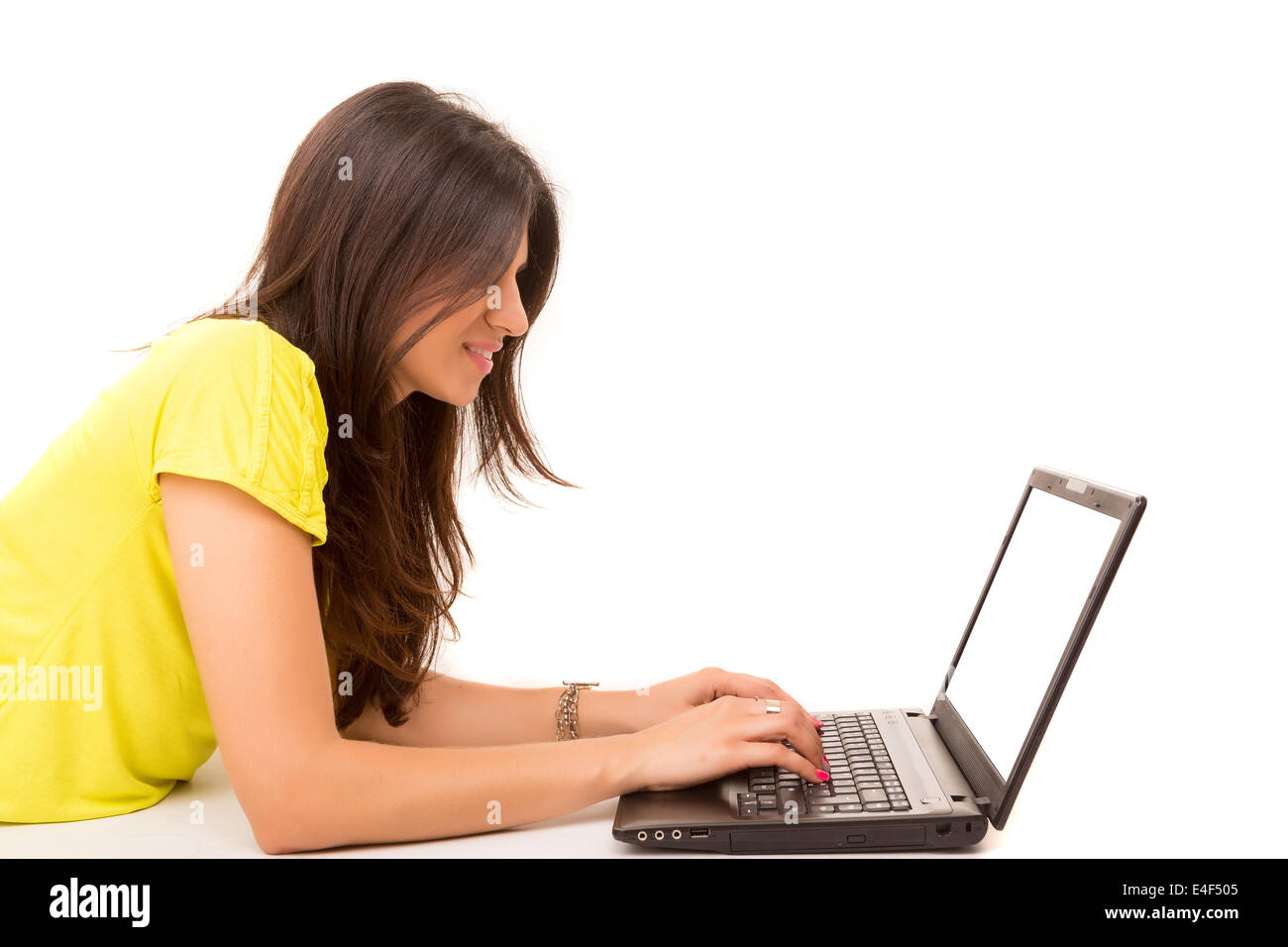Young student working with her laptop, isolated over a white background ...