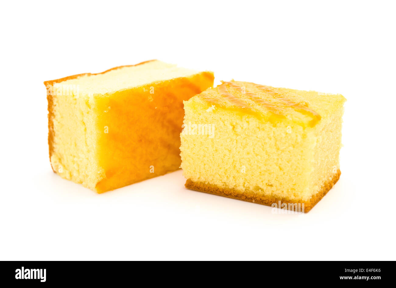 two pieces of sponge cakes on a white background Stock Photo - Alamy