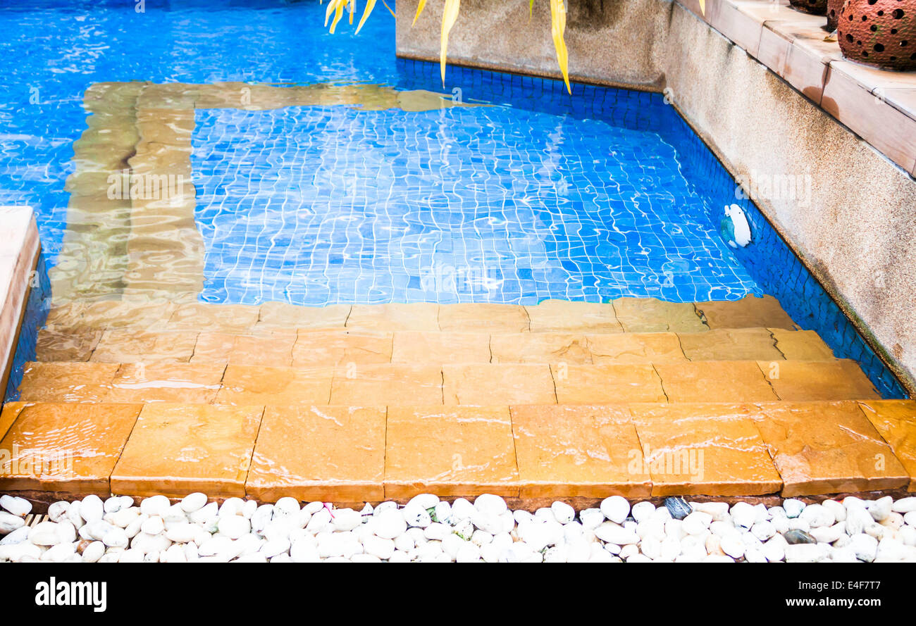 Steps to swimming pool in resort style hotel Stock Photo - Alamy