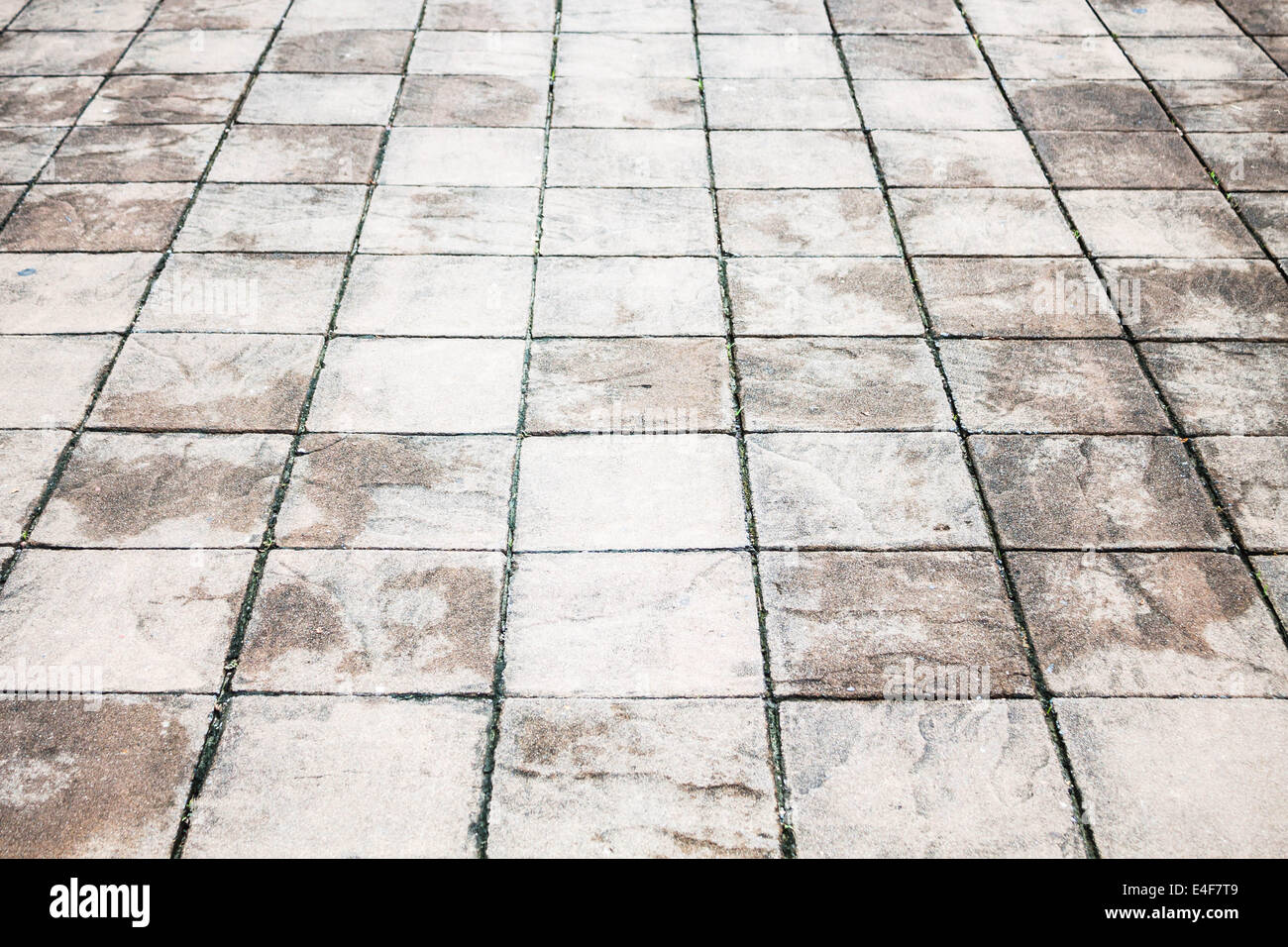 Wet foot path texture with stone plates Stock Photo - Alamy