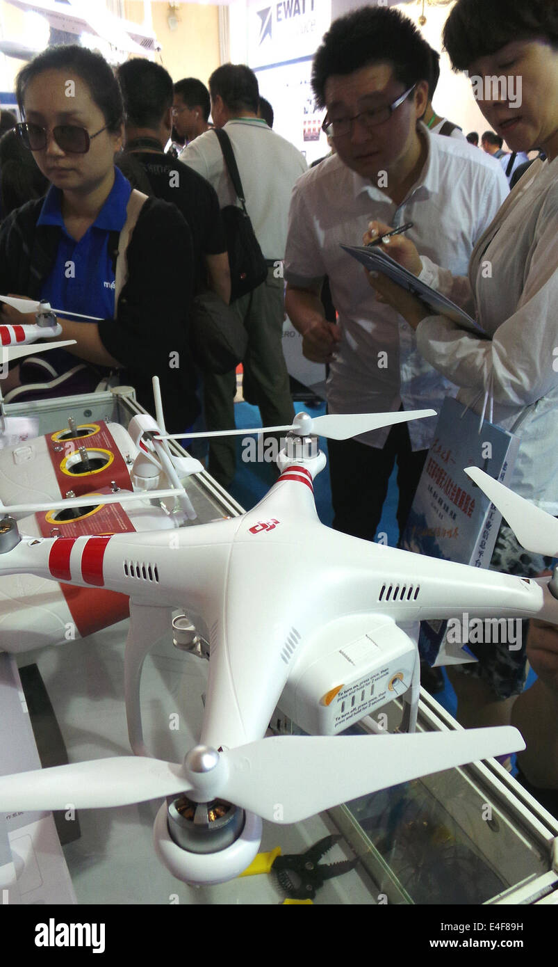 Beijing, China. 10th July, 2014. Visitors view an unmanned aerial ...