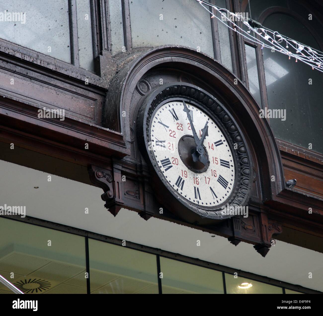 it's a photo of a public clock outdoor in the street. It's in a train ...