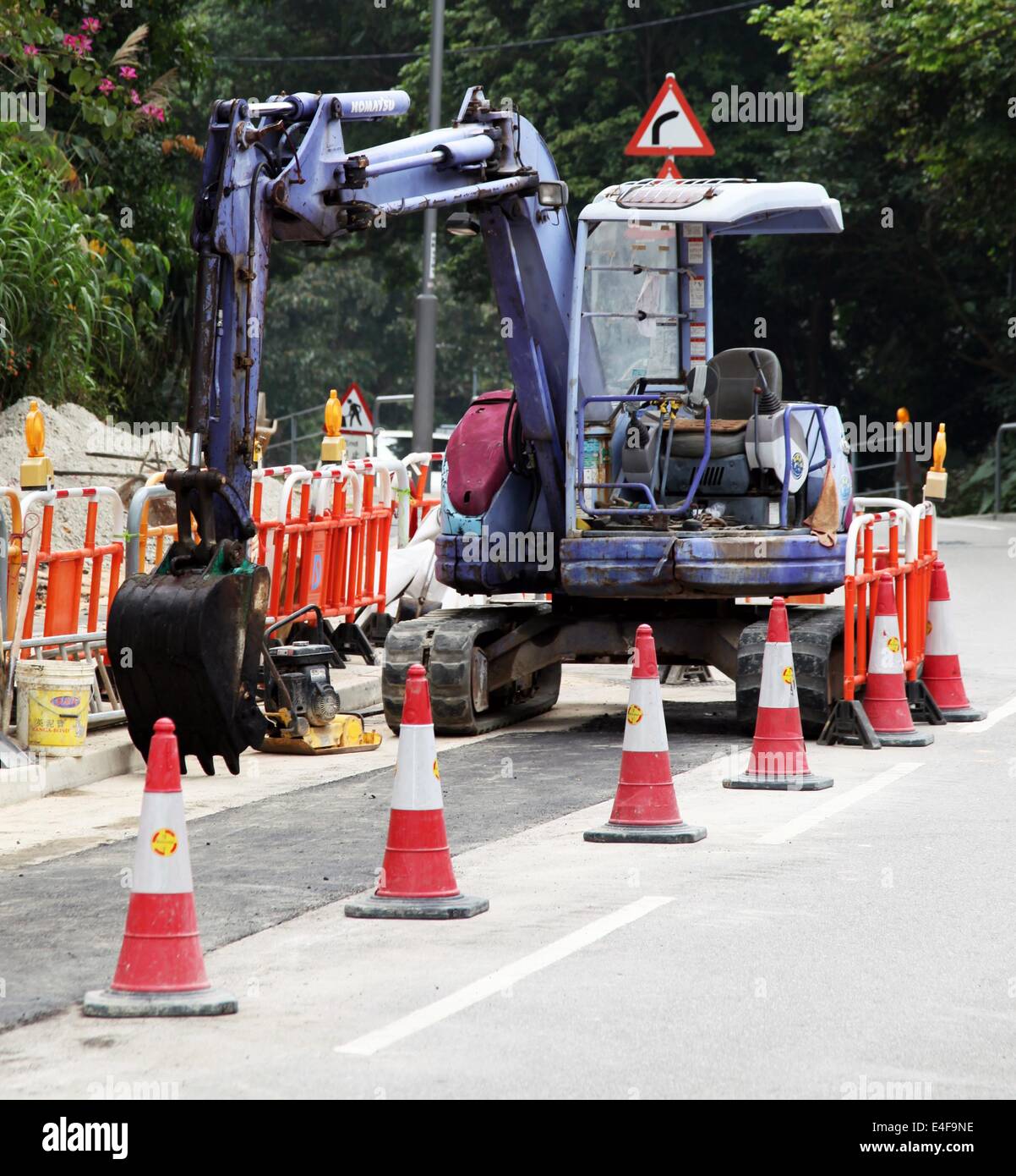 it's a photo of a small excavator in purple color that stand on a the ...