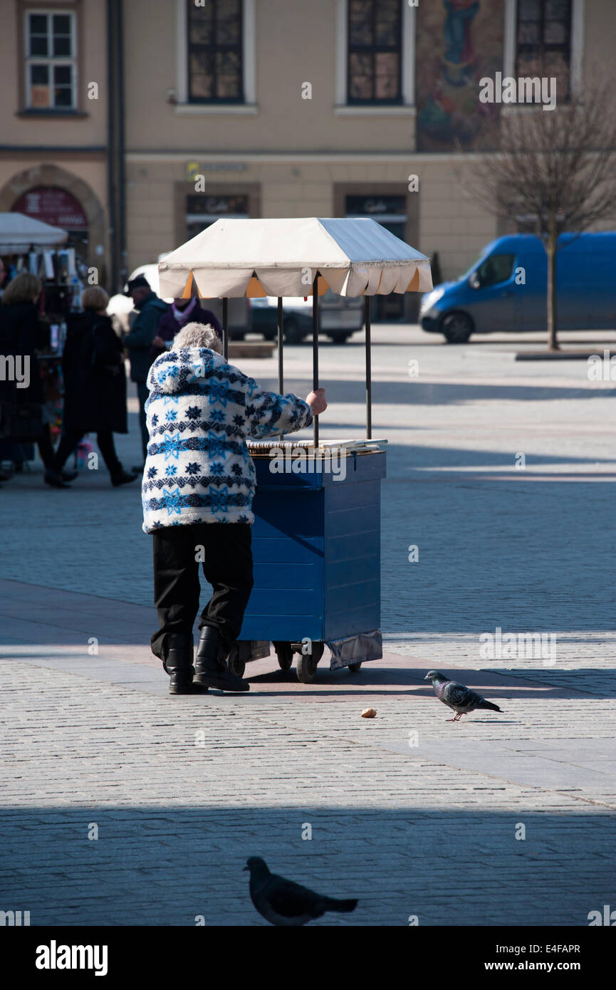A market trader pushes their stall into position in the Main Square ...