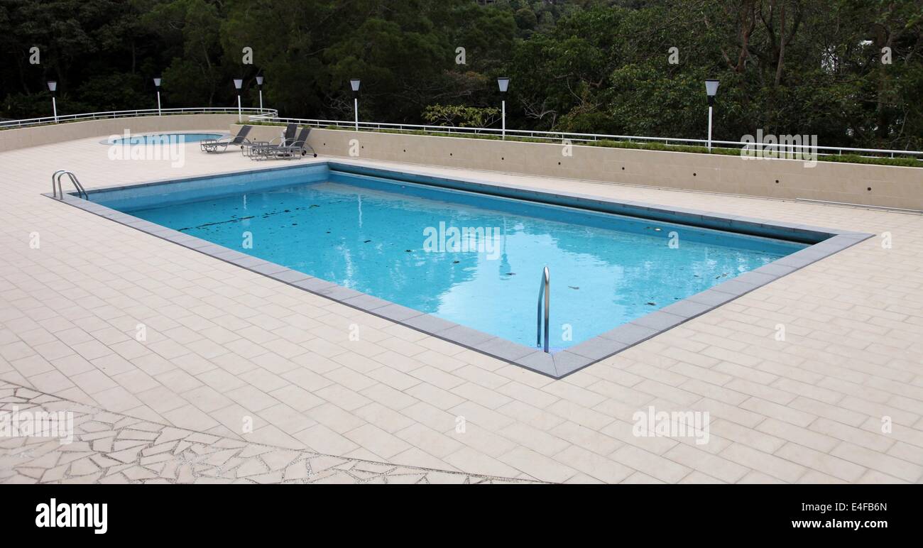 It's a photo a a small private swimming pool which is outdoor. There is ...