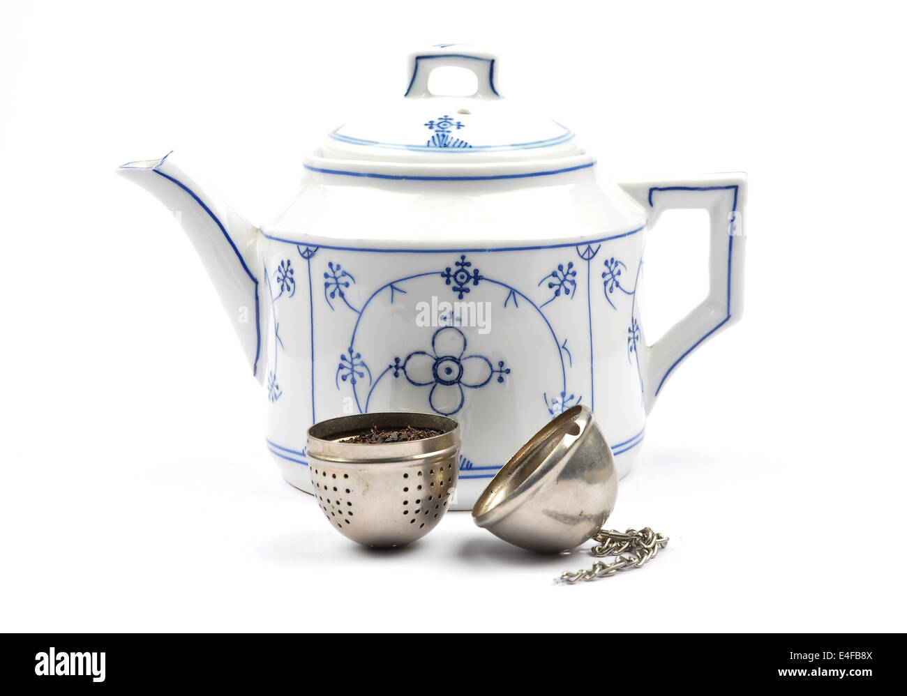 Teapot and tea ball Stock Photo - Alamy