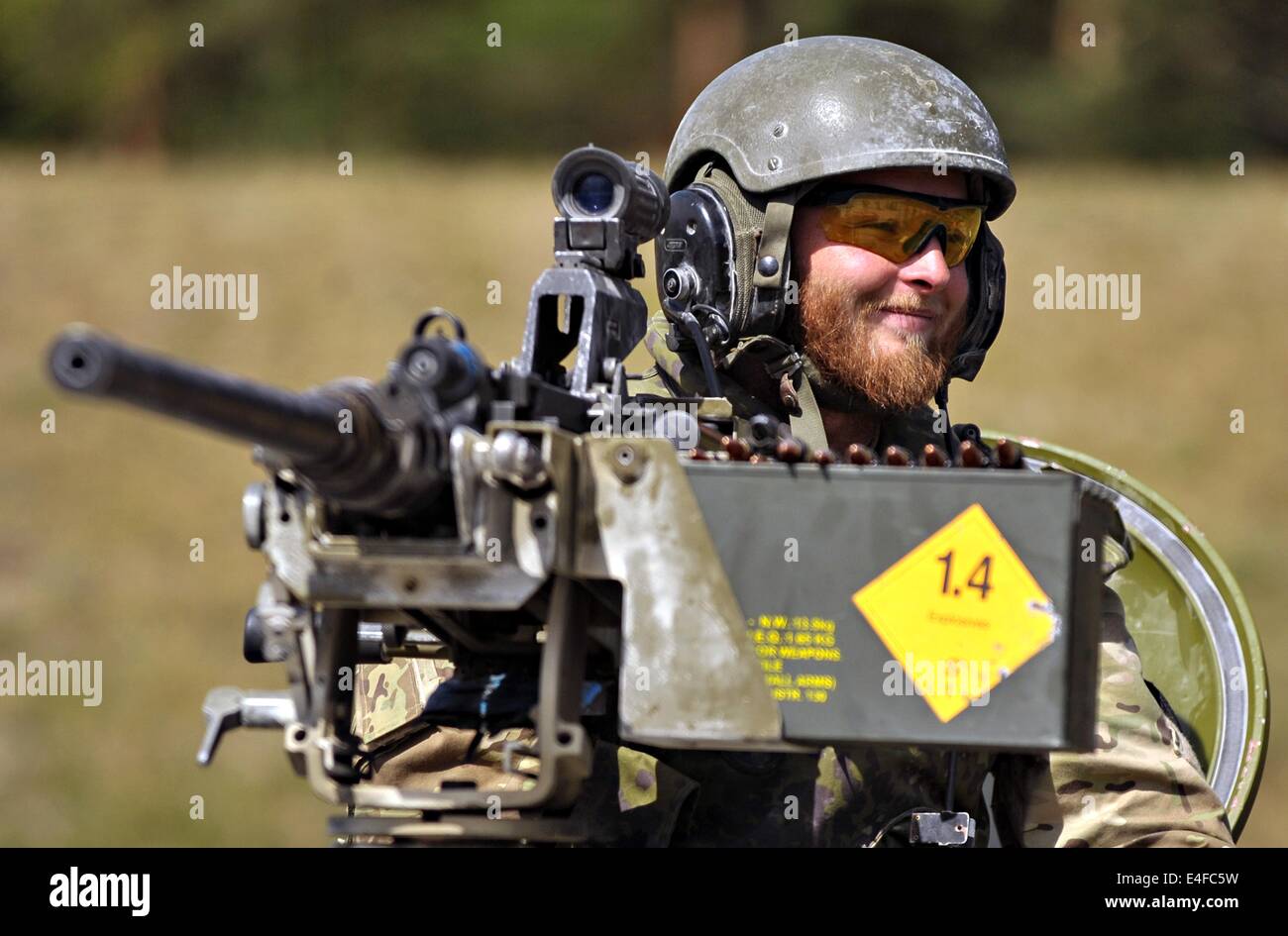 A Danish soldier mans the gunner position on an M113G3DK armored ...