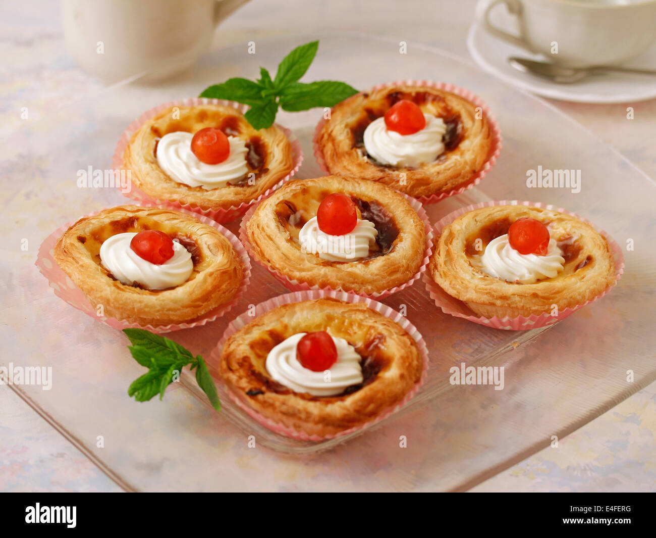 Puff pastry tartlets with custard. Recipe available Stock Photo - Alamy