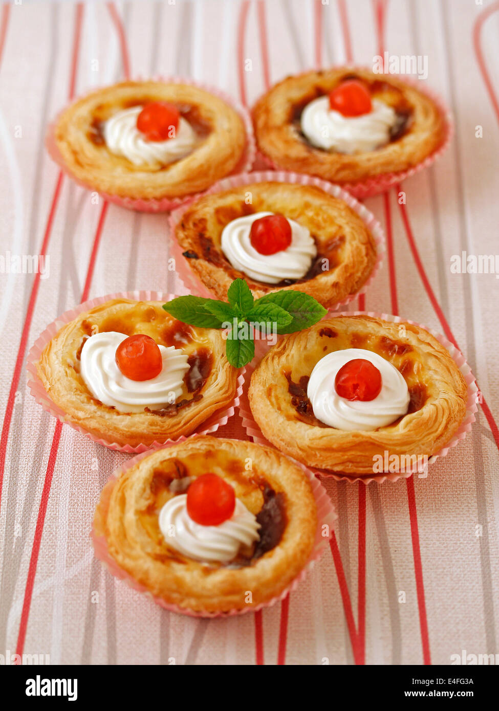 Puff pastry tartlets with custard. Recipe available Stock Photo - Alamy