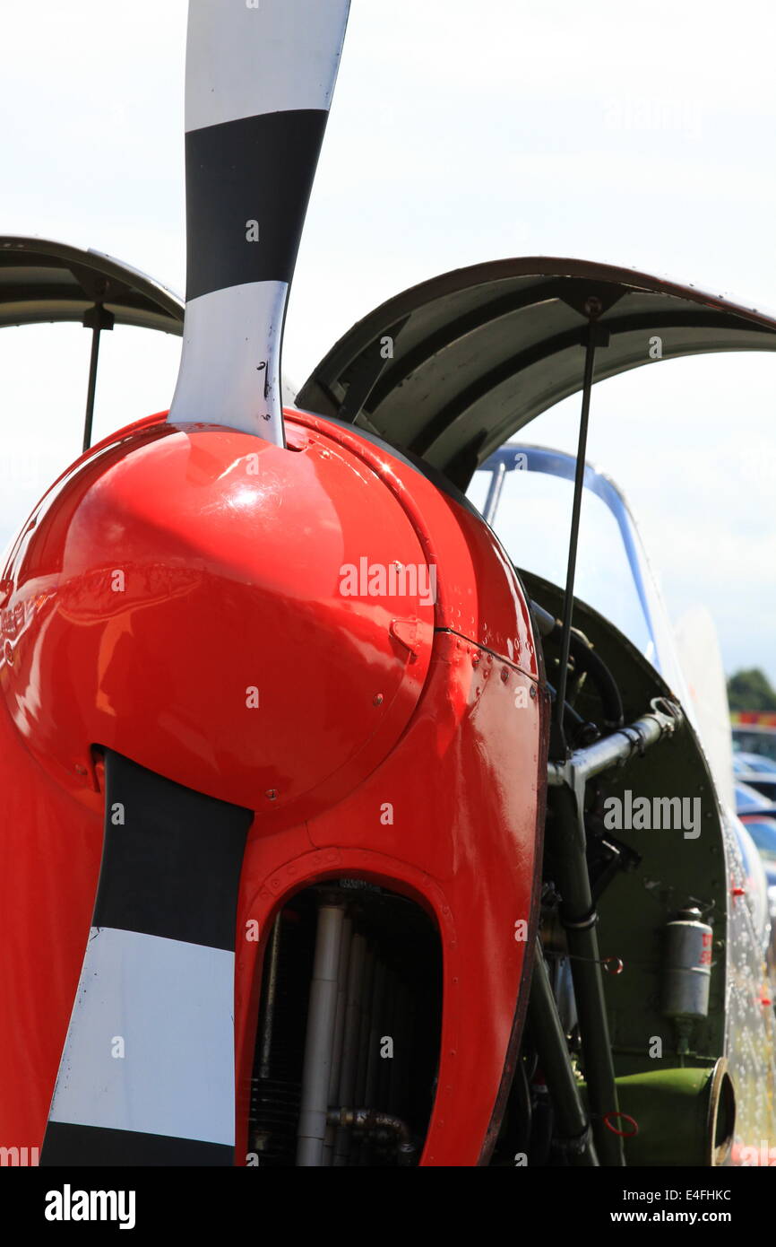 Red engine cowling early type of airplane driven black and white ...