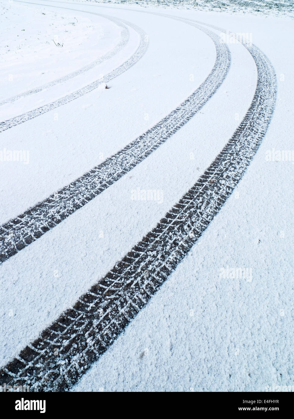 Car Tyre Tracks in the Snow Stock Photo - Alamy
