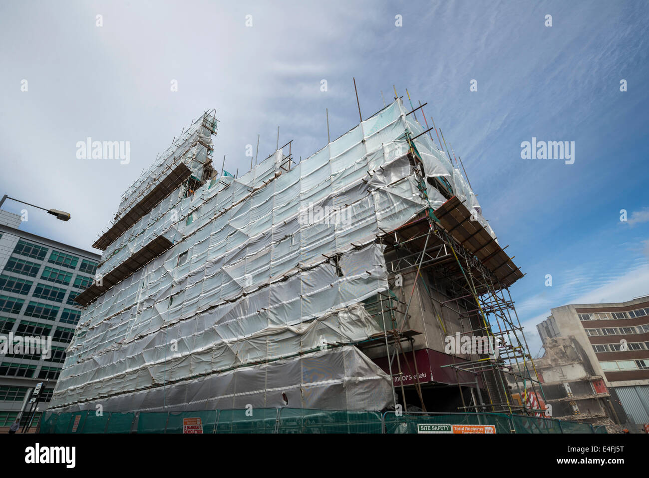Building being demolished covered in scaffolding and sheeting Sheffield ...