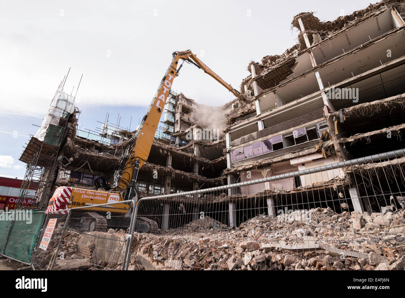 Hi rise building being demolished with high reach machinery Sheffield ...