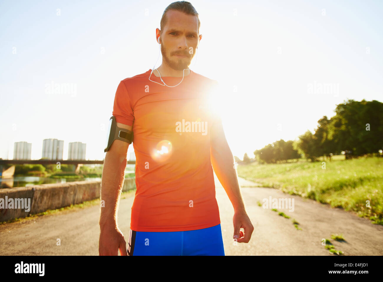 Serious handsome young sportsman standing hi-res stock photography and ...