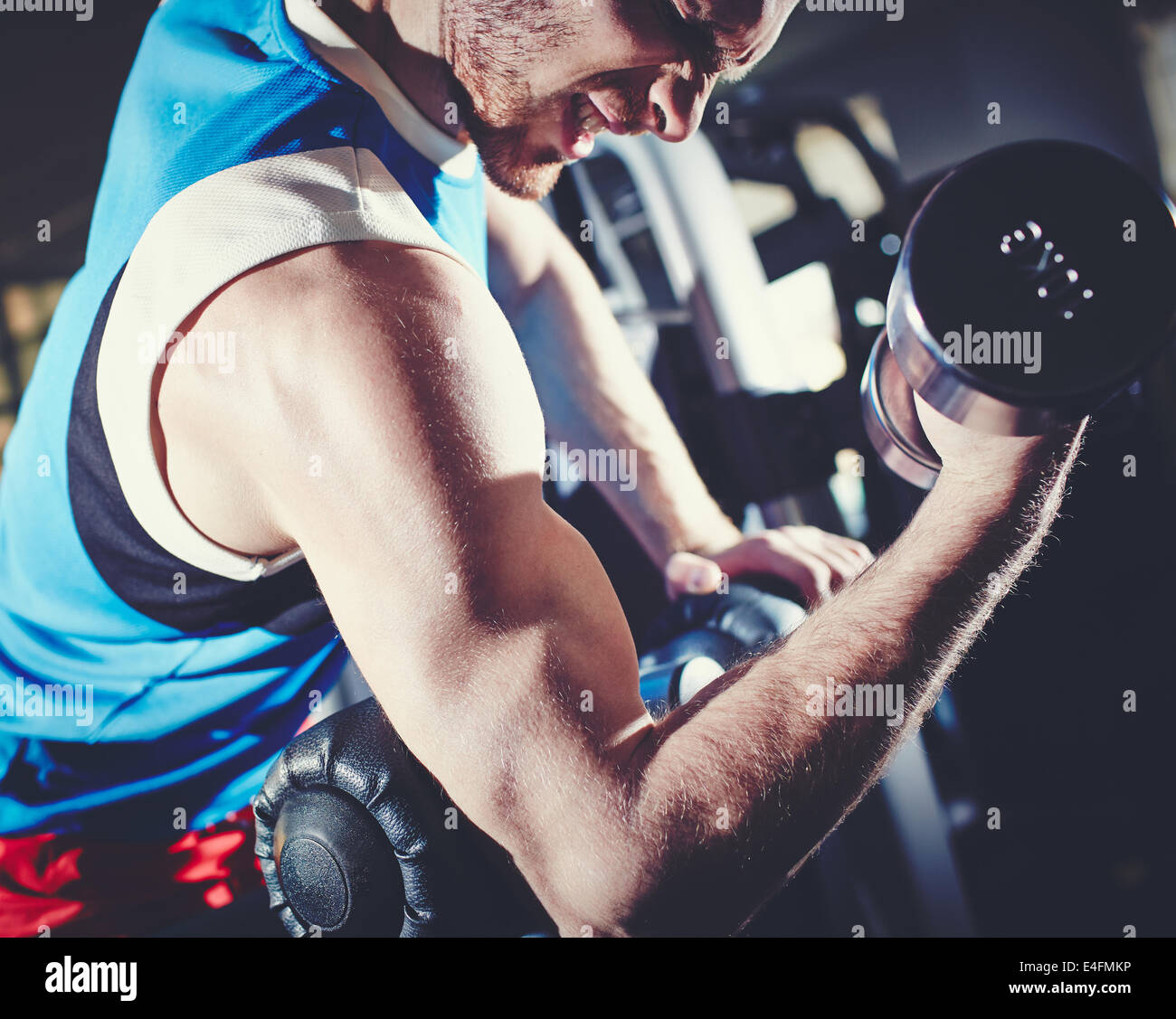 Arm of strong man doing exercise with barbell Stock Photo - Alamy